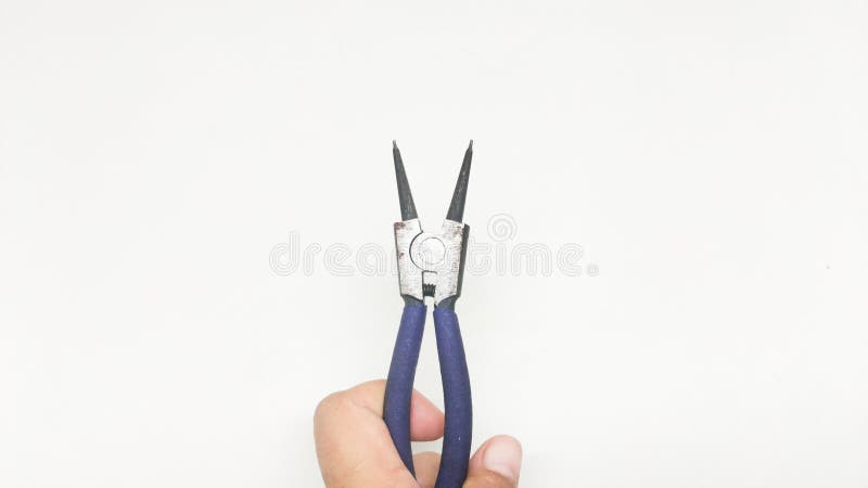 A Mechanic is Using a Blue-handled Circlip Pliers To Remove a Piston ...