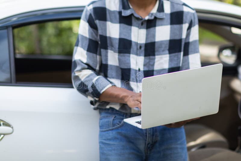 Mechanic is Using a Computer To Check the System of the Control Box ...