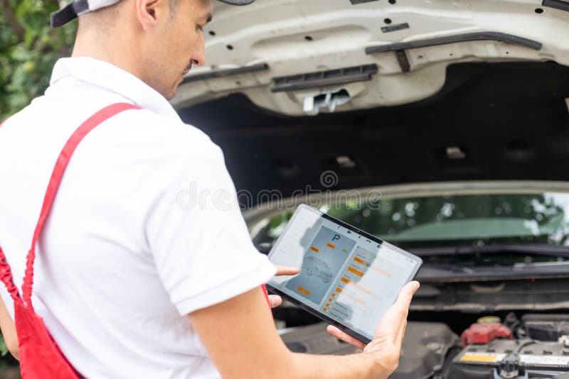 Mechanic Using Digital Tablet in Workshop Stock Photo - Image of soccer ...