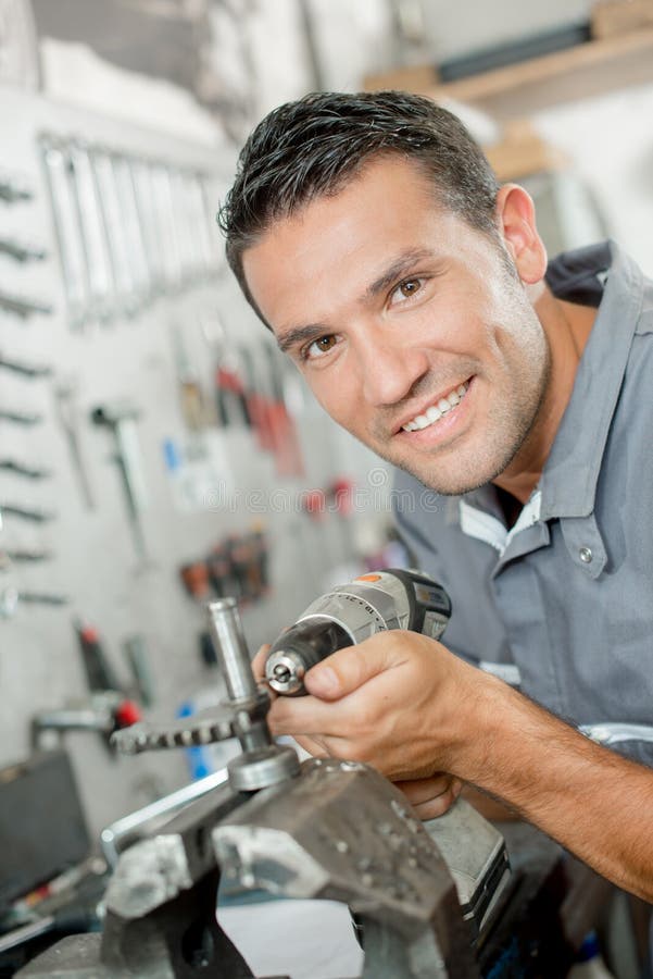 Mechanic Using Drill To Adjust Part Stock Photo - Image of modify ...