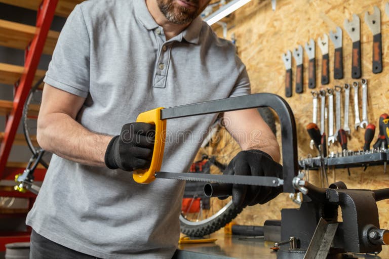 Mechanic using hacksaw stock image. Image of maintenance - 382384207