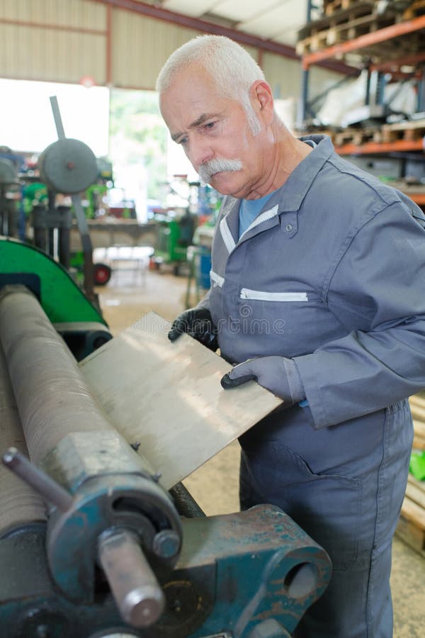 Mechanic Using Industrial Lathe Machine Stock Photo - Image of person ...