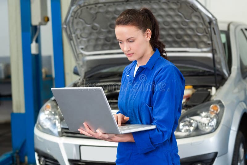 Mechanic Using Laptop on Car Stock Photo - Image of wireless, blue ...