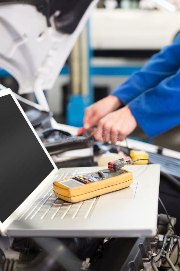 Mechanic Using Laptop on Car Stock Image - Image of machinist, indoors ...