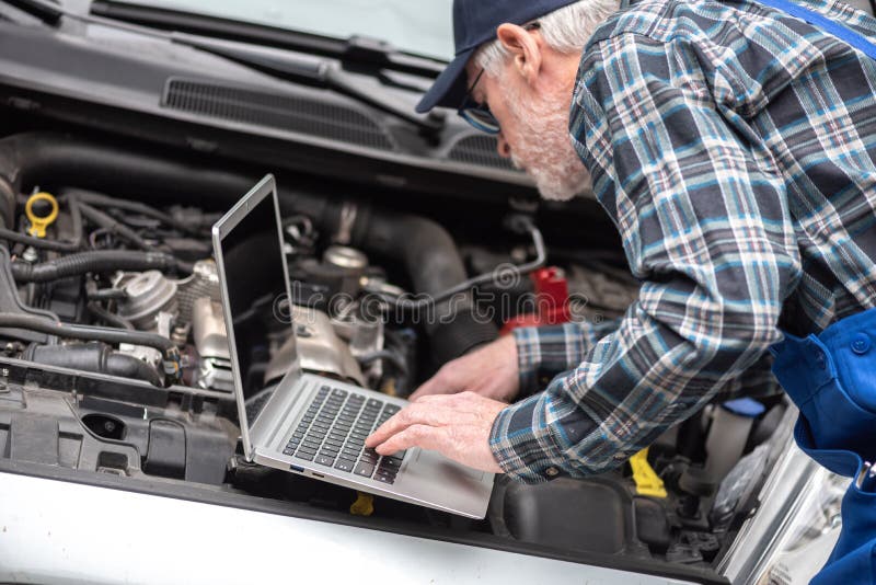 Mechanic Using Laptop for Checking Car Engine Stock Image - Image of ...
