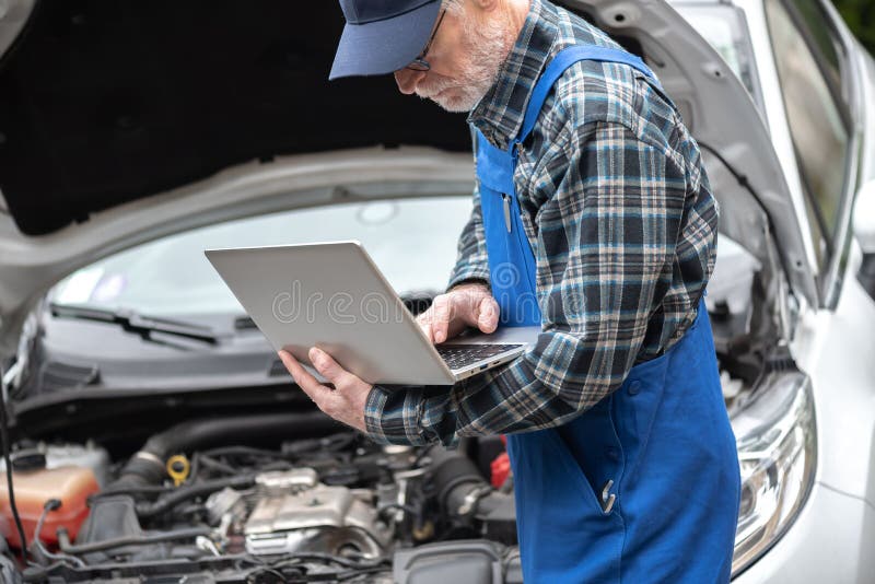 Mechanic Using Laptop for Checking Car Engine Stock Image - Image of ...