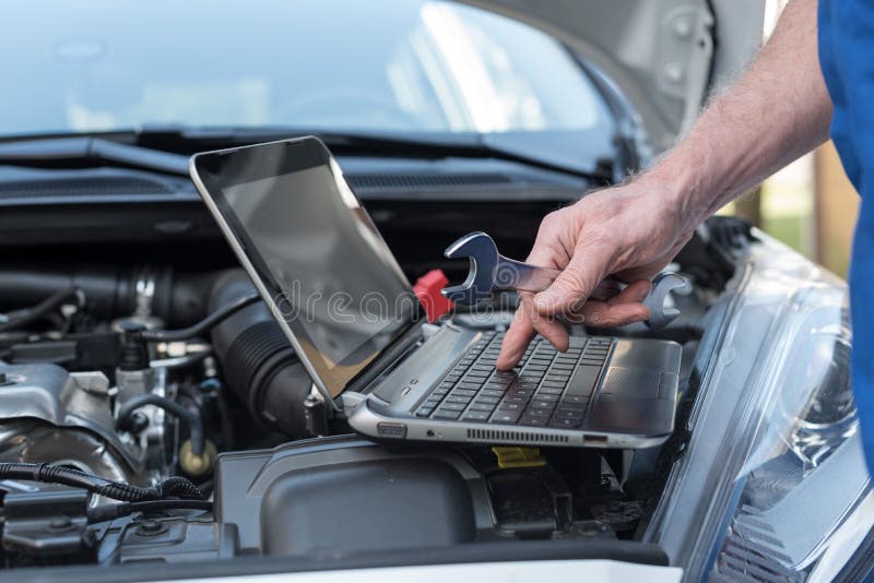 Mechanic Using Laptop for Checking Car Engine Stock Image - Image of ...