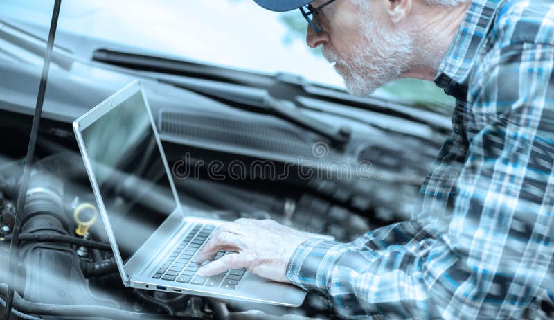 Mechanic Using Laptop for Checking Car Engine Light Effect Stock Photo ...