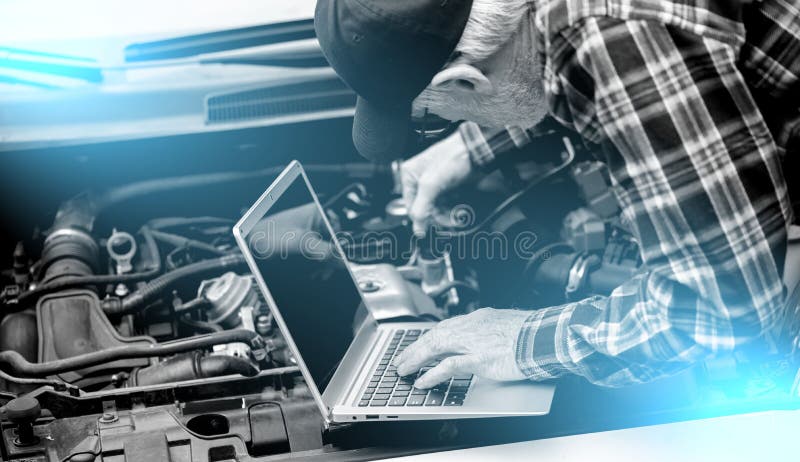 Mechanic Using Laptop For Checking Car Engine; Light Effect Stock Photo ...