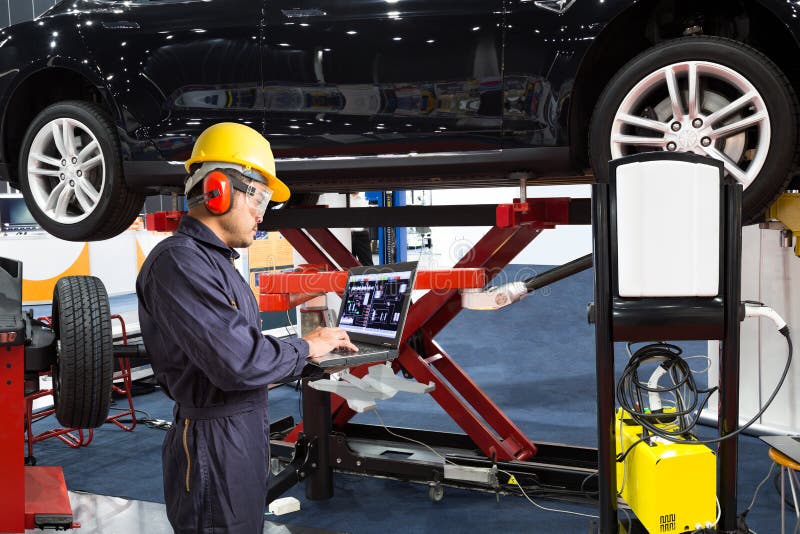 Mechanic Using Compute for Diagnostic Machine Tools Ready To Be Used ...