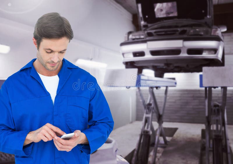 Mechanic Using Mobile Phone at Garage Stock Photo - Image of caucasian ...