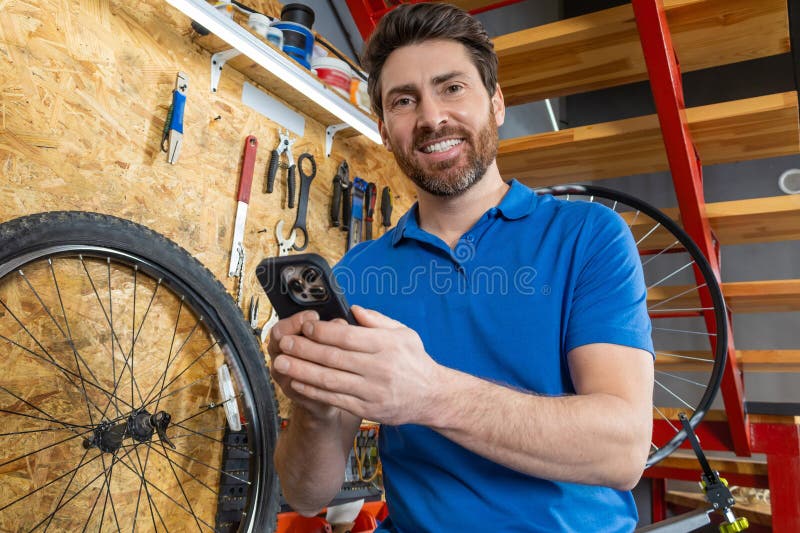 Mechanic Using Smartphone in Workshop Stock Image - Image of shop ...
