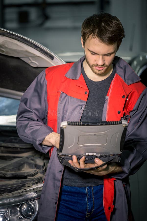 Mechanic Examining Car Engine with Help of Laptop Editorial Stock Image ...