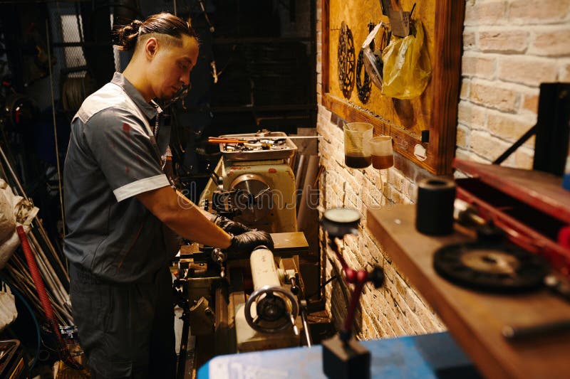 Mechanic Using Special Machine at Workbench Stock Image - Image of ...