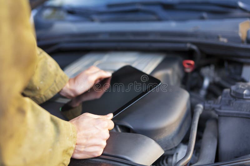 Using Tablet Computer in Auto Shop Stock Photo - Image of ...