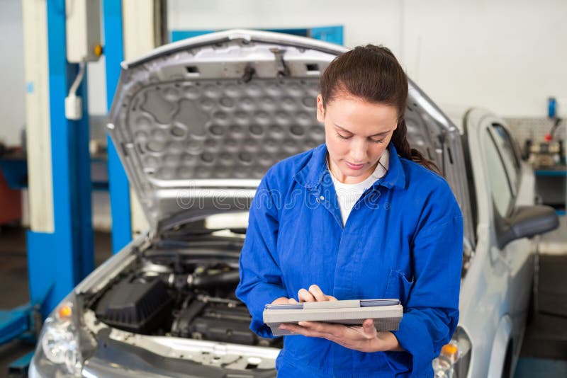 Mechanic Using Tablet To Fix Car Stock Photo - Image of attentively ...