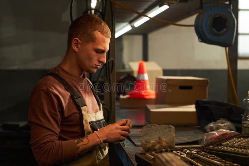 Mechanic Using Tools at His Work Stock Photo - Image of equipment ...