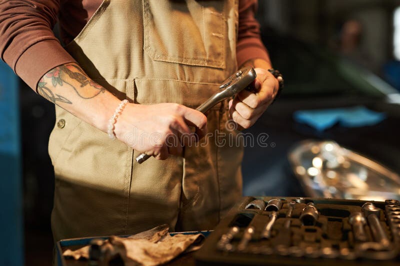 Mechanic Using Tools To Repair the Car Stock Photo - Image of repairing ...