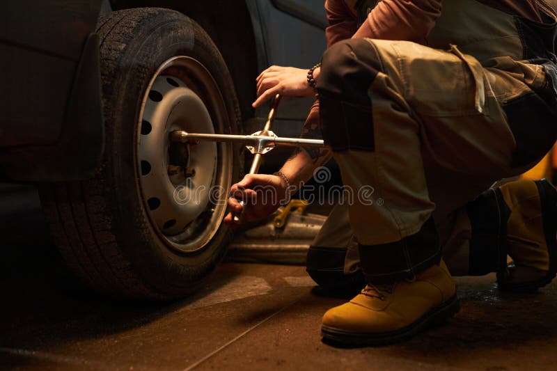 Mechanic Using Wrench To Change Wheels Stock Photo - Image of mechanic ...