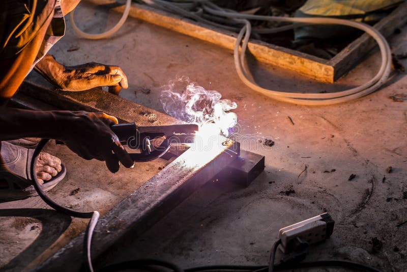 Weld iron until it sparked stock image. Image of protection - 155398929