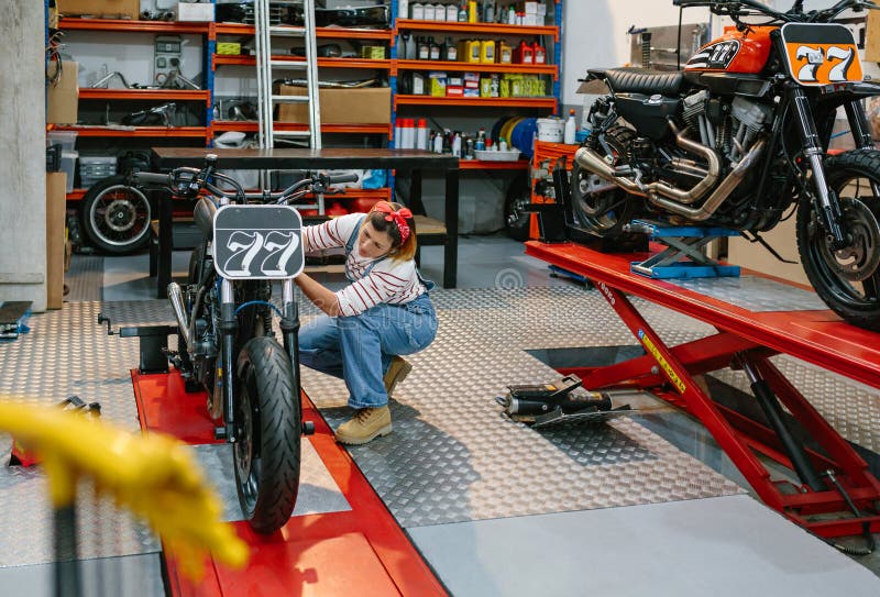 Mechanic Woman Checking Custom Motorcycle on Factory Stock Photo ...