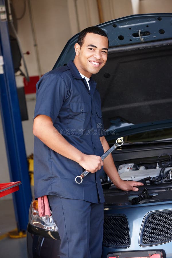 Mechanic at work stock image. Image of bonnet, garage - 21039437