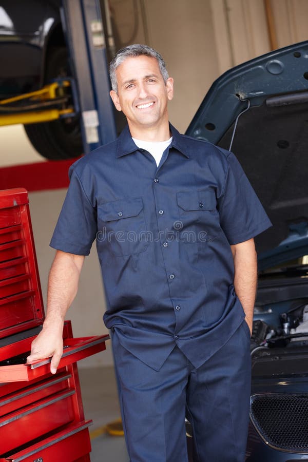 Mechanic at work stock image. Image of bonnet, garage - 21039437