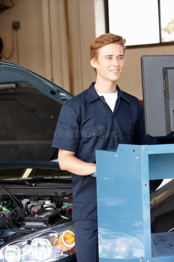 Mechanic at work stock photo. Image of confident, happy - 21039922
