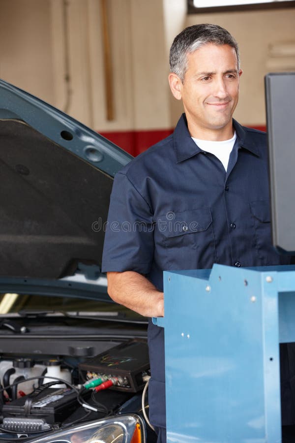 Mechanic at work stock image. Image of repairing, happy - 21038403