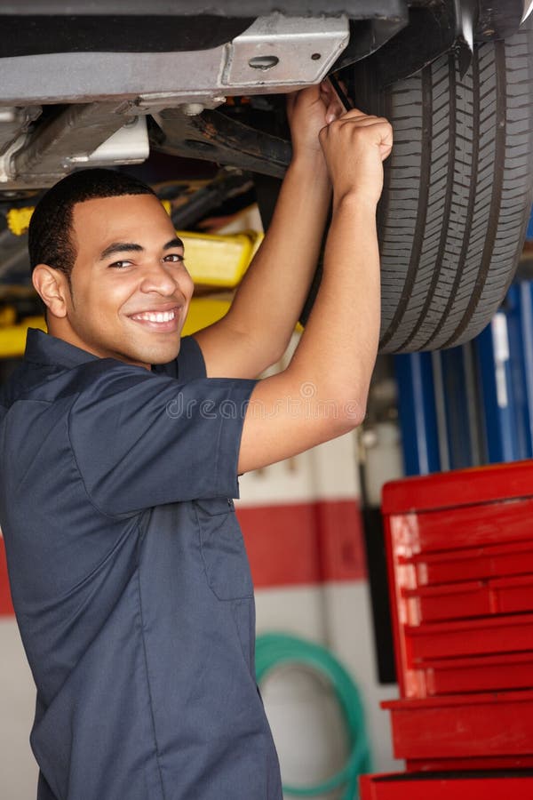 Mechanic at work stock image. Image of bonnet, garage - 21039437