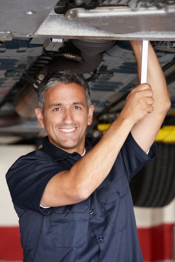 Mechanic at work stock photo. Image of garage, vertical - 21040592