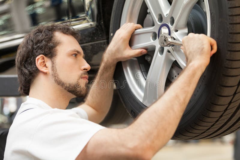 Mechanic at work. stock image. Image of mode, examining - 32808815