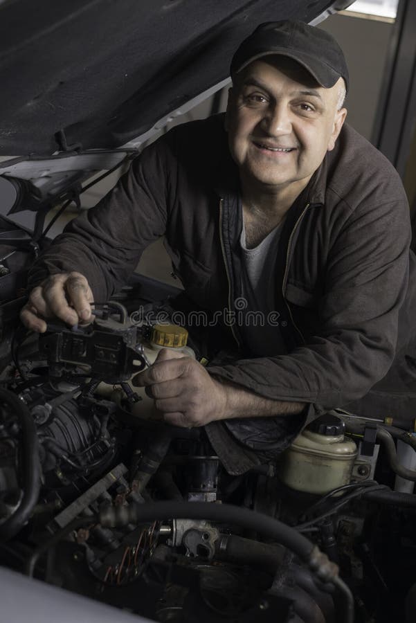 Mechanic at work stock photo. Image of auto, happy, changing - 30851486
