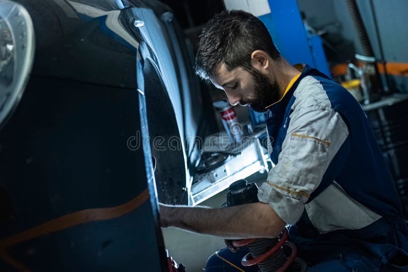 Mechanic at work . editorial image. Image of mechanical - 266113090