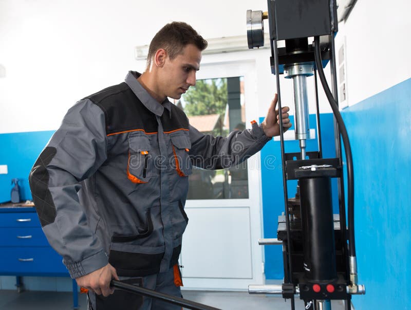 Mechanic at work stock photo. Image of motor, coveralls - 75370086