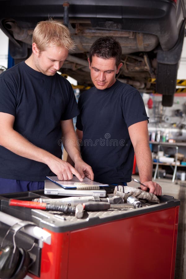 Mechanic with Work Order stock photo. Image of machine - 20299286