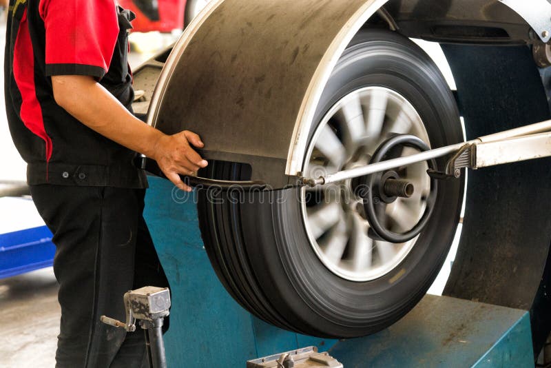 Mechanic Worker Makes Computer Wheel Balancing on Special Equipment ...