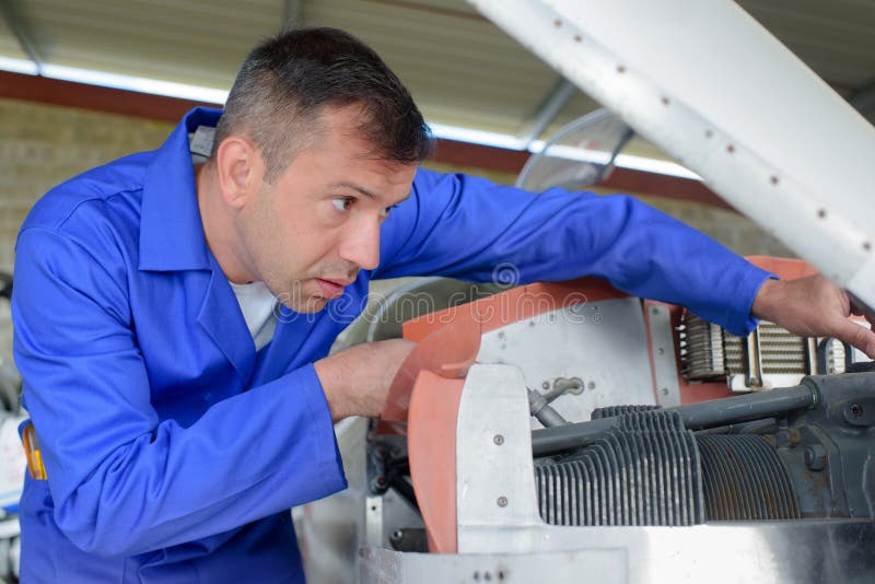 Mechanic Working on Aircraft Stock Photo - Image of alignment, shaft ...