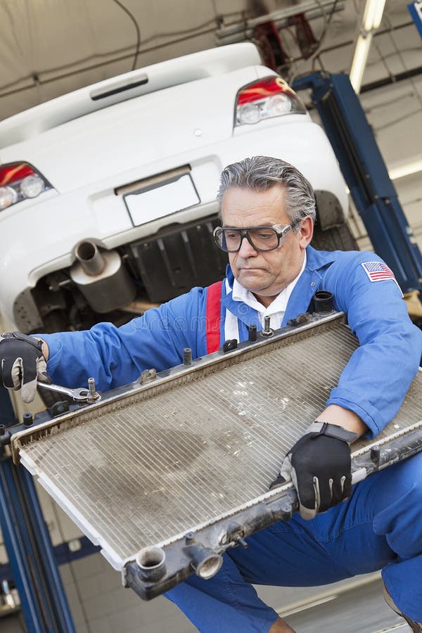 Mechanic Working on an Auto Part of an Car with a Wrench Stock Image ...