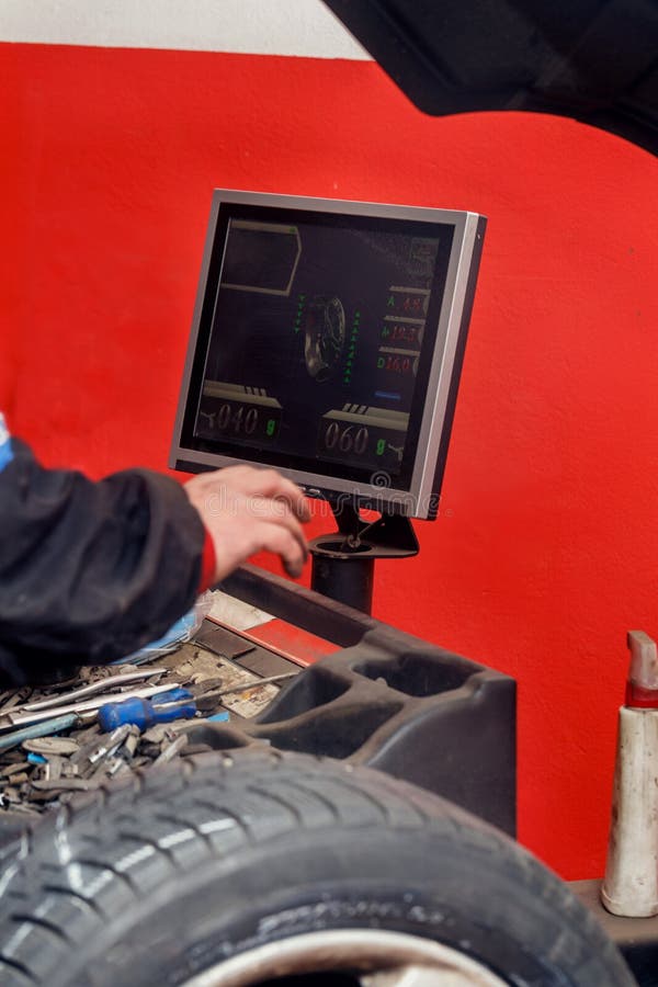 Mechanic Working on Balancing Machine Stock Photo - Image of mechanic ...