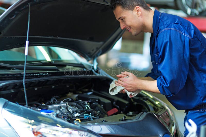 Car Mechanic Working on a Car Stock Image - Image of adjusting ...