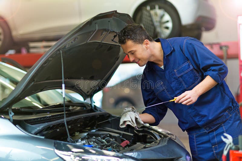 Car Mechanic Working on a Car Stock Photo - Image of fixing, confident ...