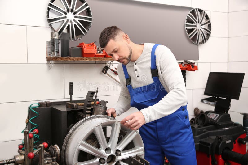 Mechanic Working with Car Disk Lathe Machine at Service Stock Image ...