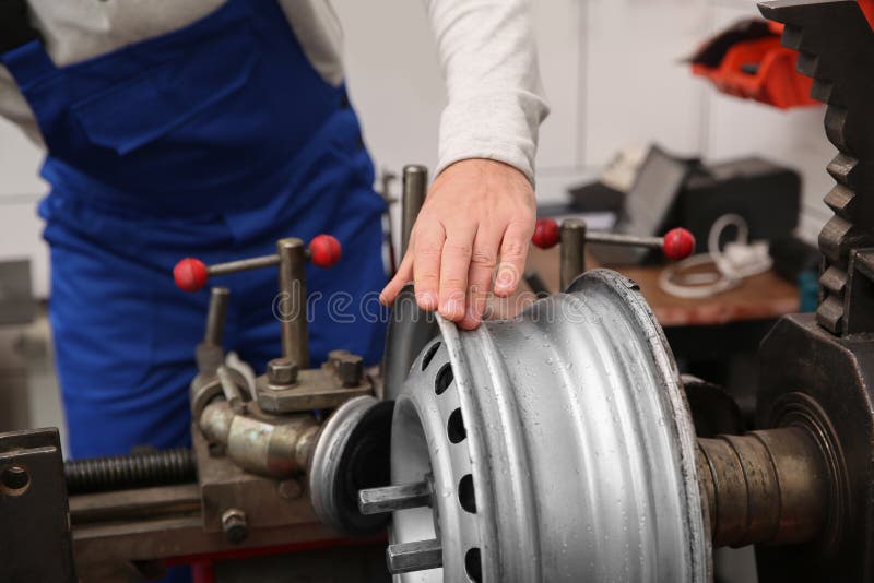 Mechanic Working with Car Disk Lathe Machine at Service, Closeup Stock ...