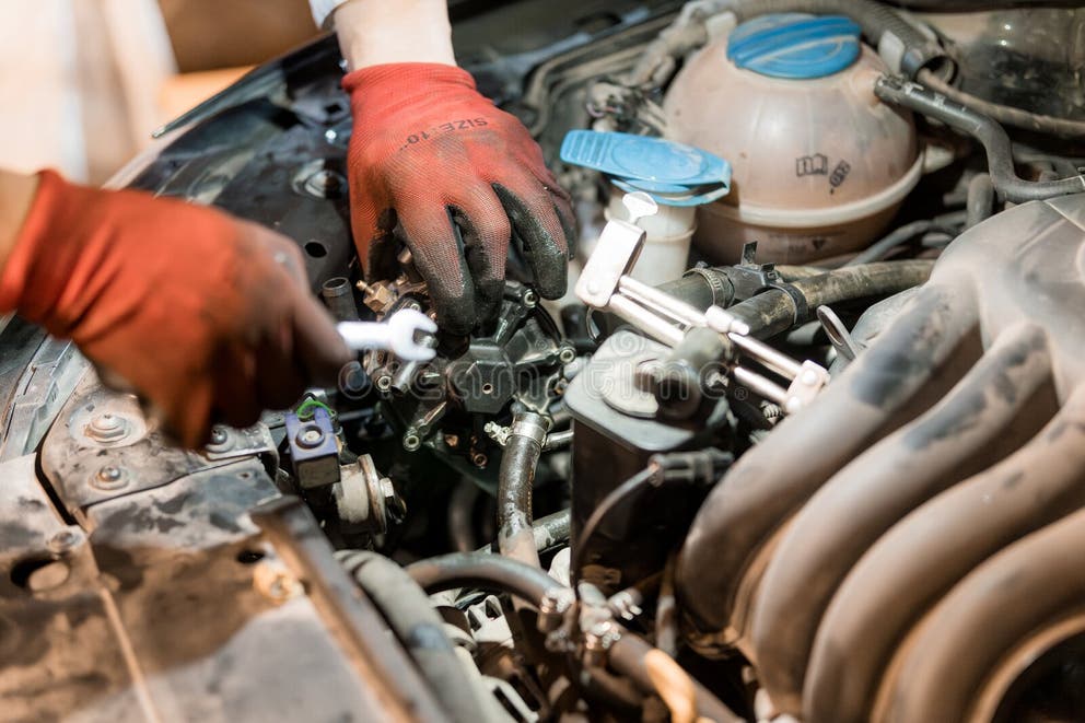 Mechanic Working on Car Engine with Tools Stock Image - Image of ...