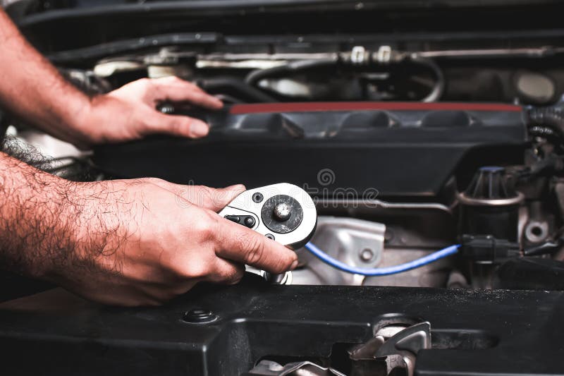 Mechanic Working on Car Engine with Tools Stock Photo - Image of ...