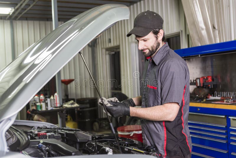 Mechanic Working on Car in His Shop Stock Image - Image of hood ...