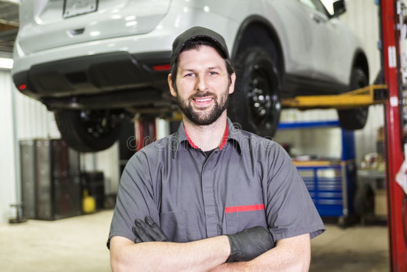 Mechanic Working on Car in His Shop Stock Photo - Image of motor ...