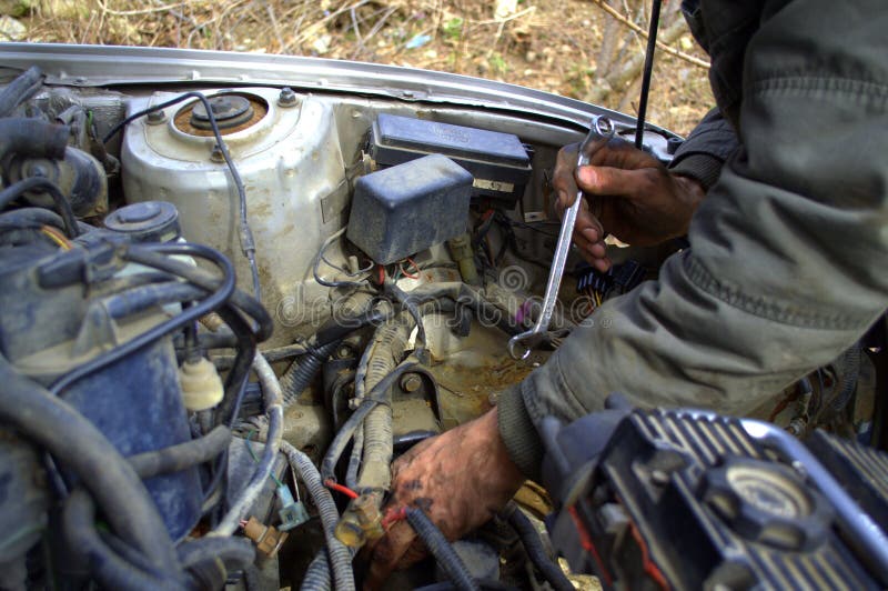 Mechanic working on car stock image. Image of grunge - 67982989