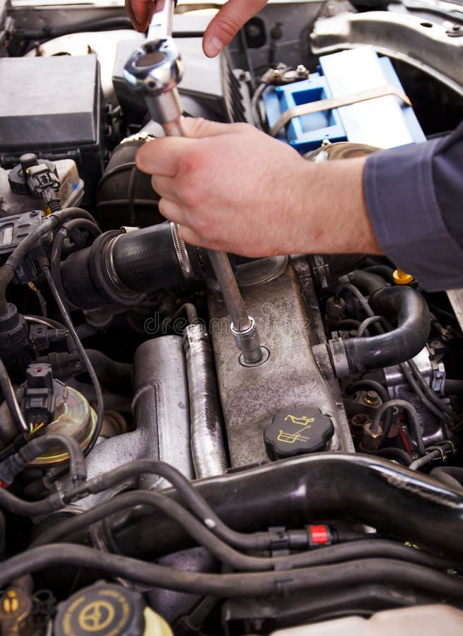 Mechanic Working in a Car Under the Hood Stock Image - Image of motor ...